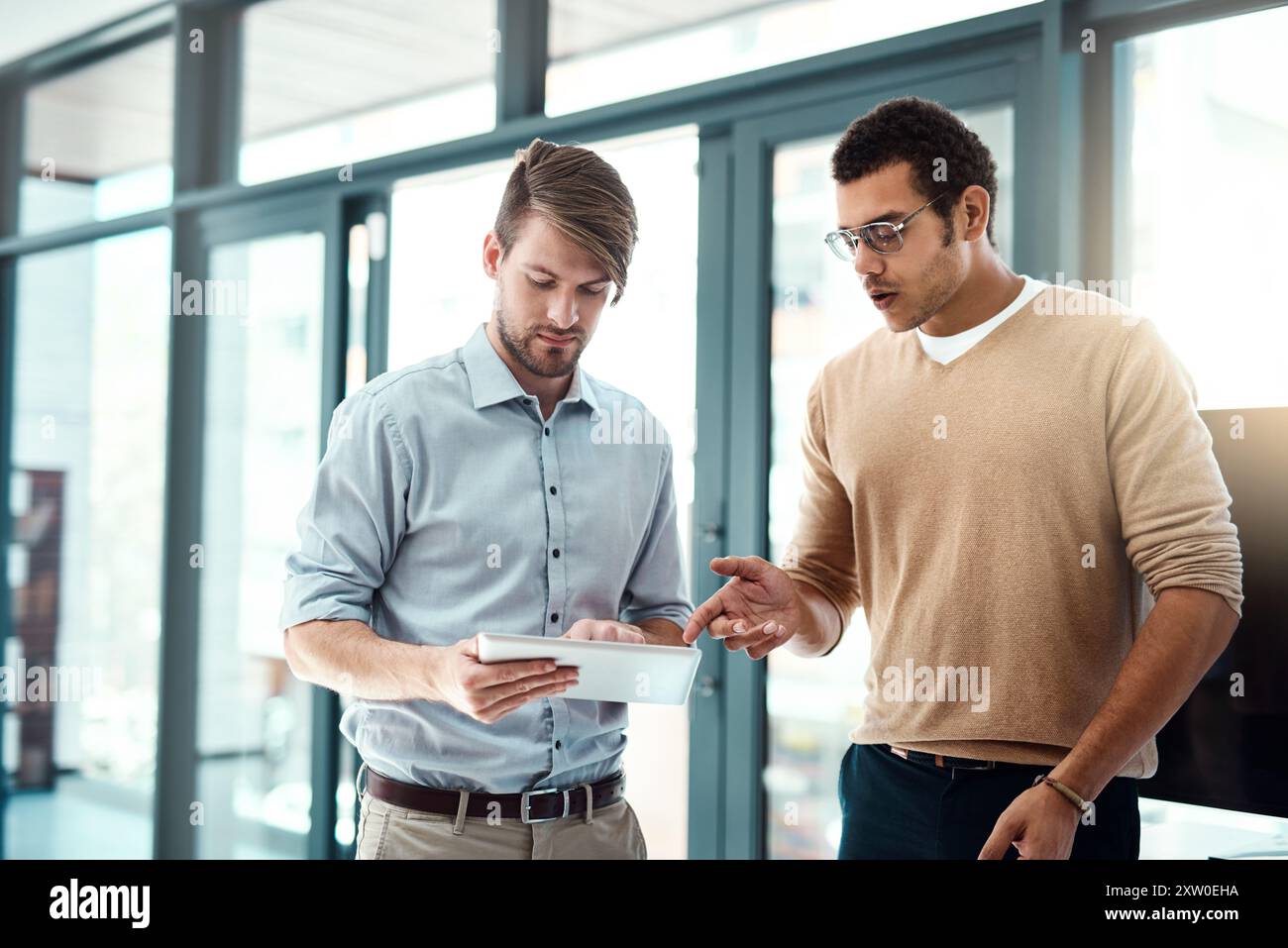 Tablet, business men and digital collaboration for app developer ...