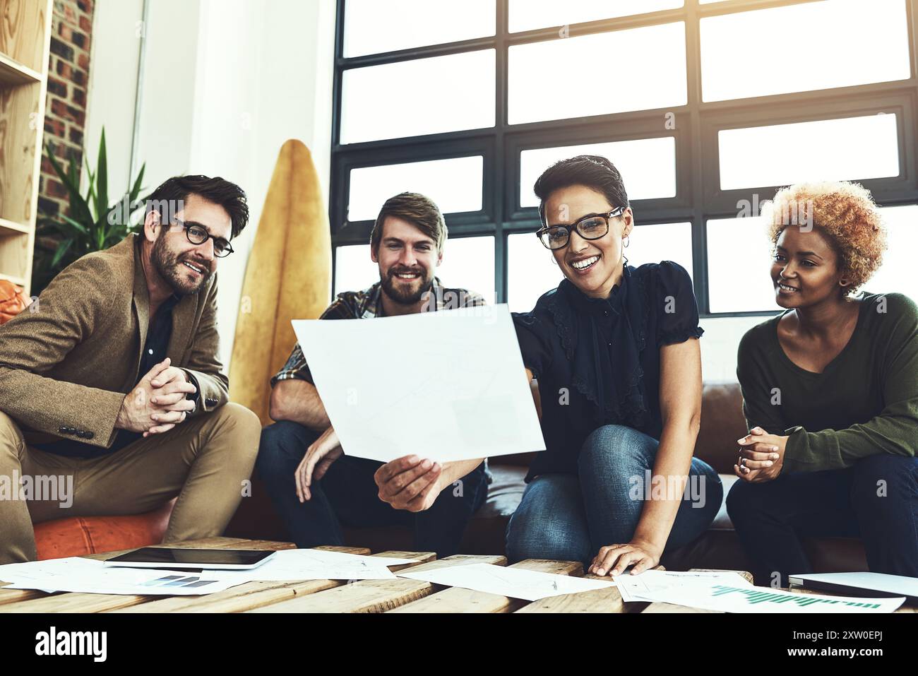 People, documents and planning in lounge at startup for charts for ...