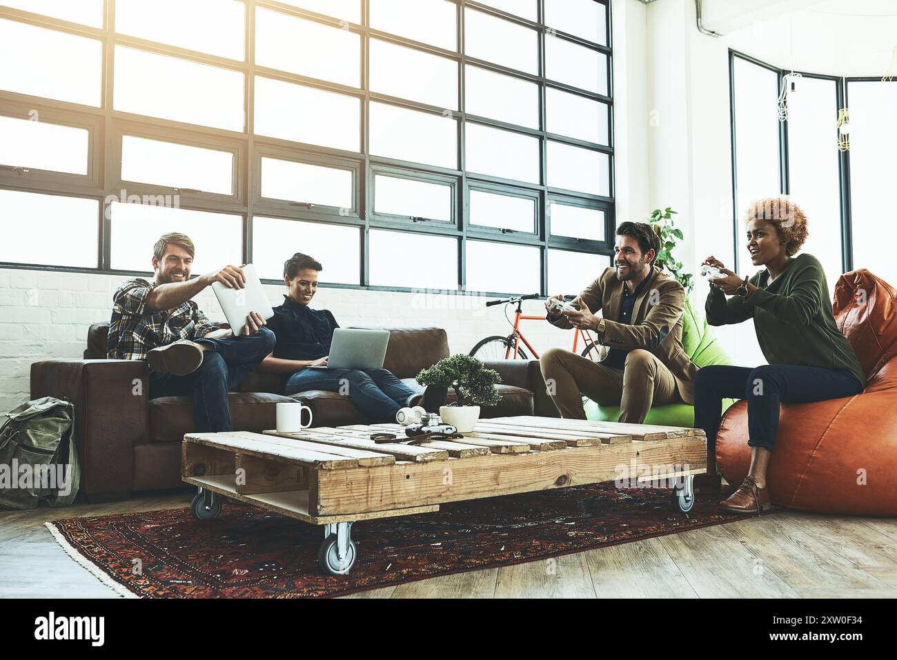 Console, technology and business people with video game in office for ...