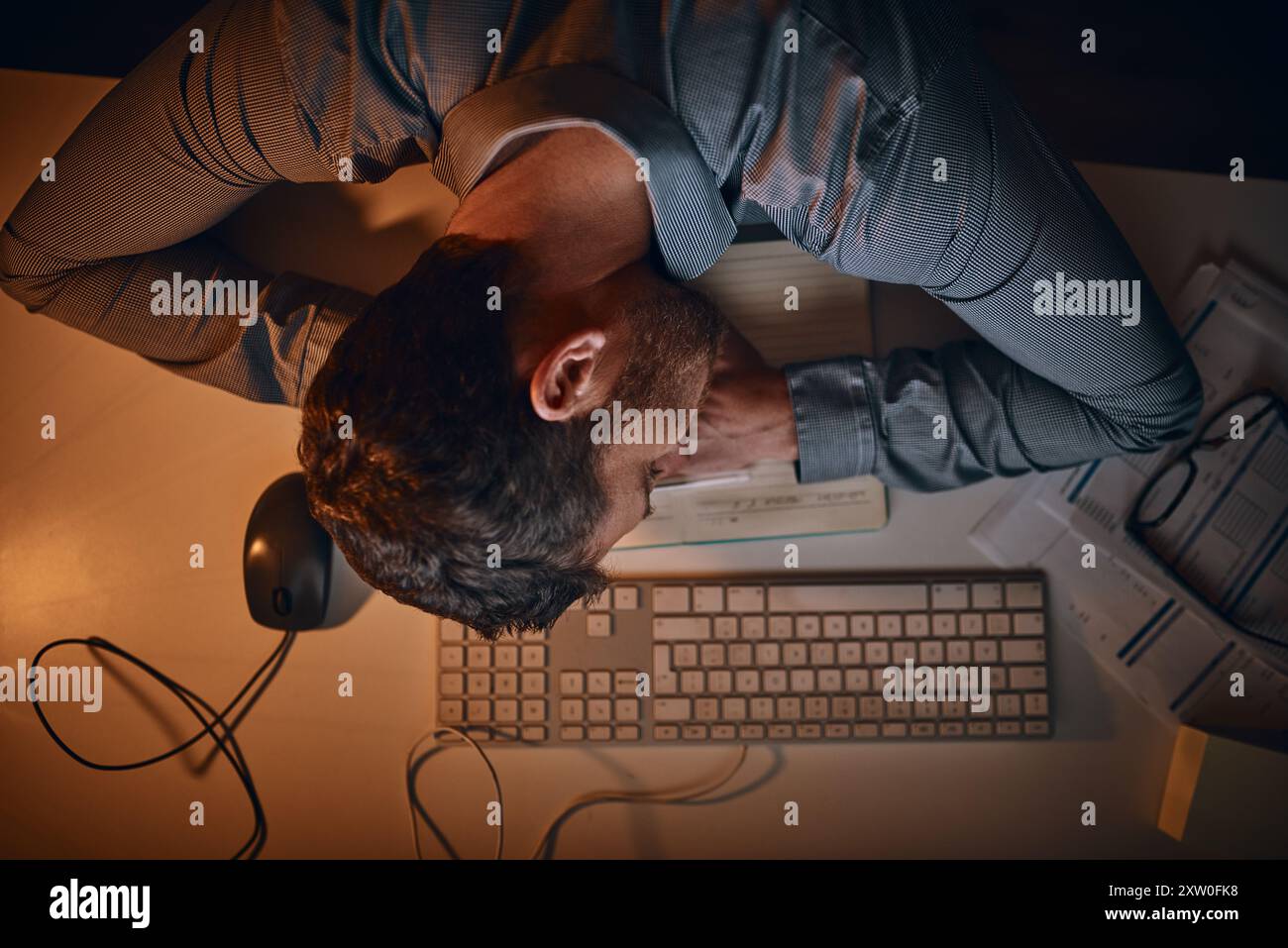 Business, man and sleeping in office at night with burnout, overtime ...