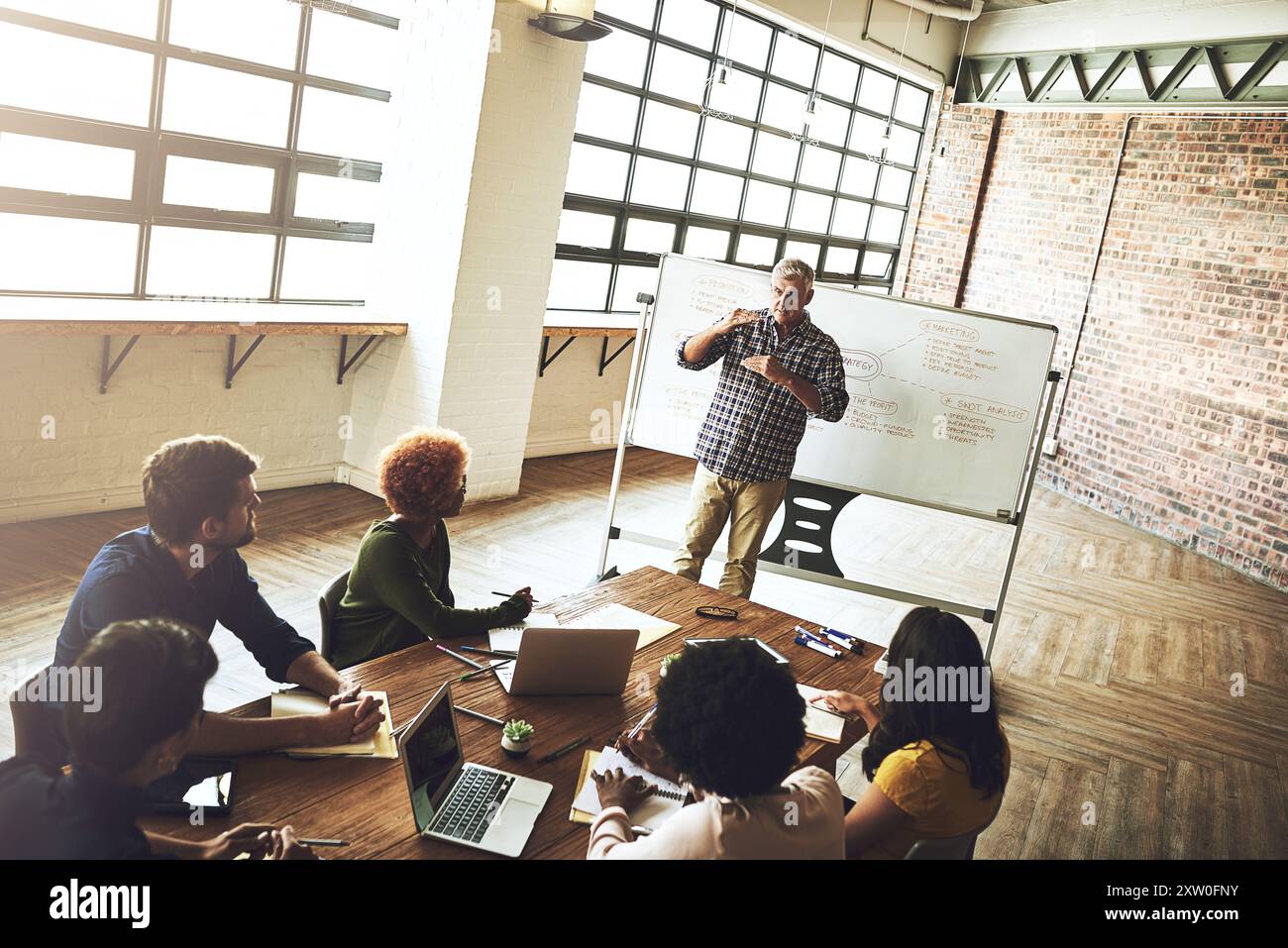 Man, whiteboard and workshop for business plan at meeting with team ...