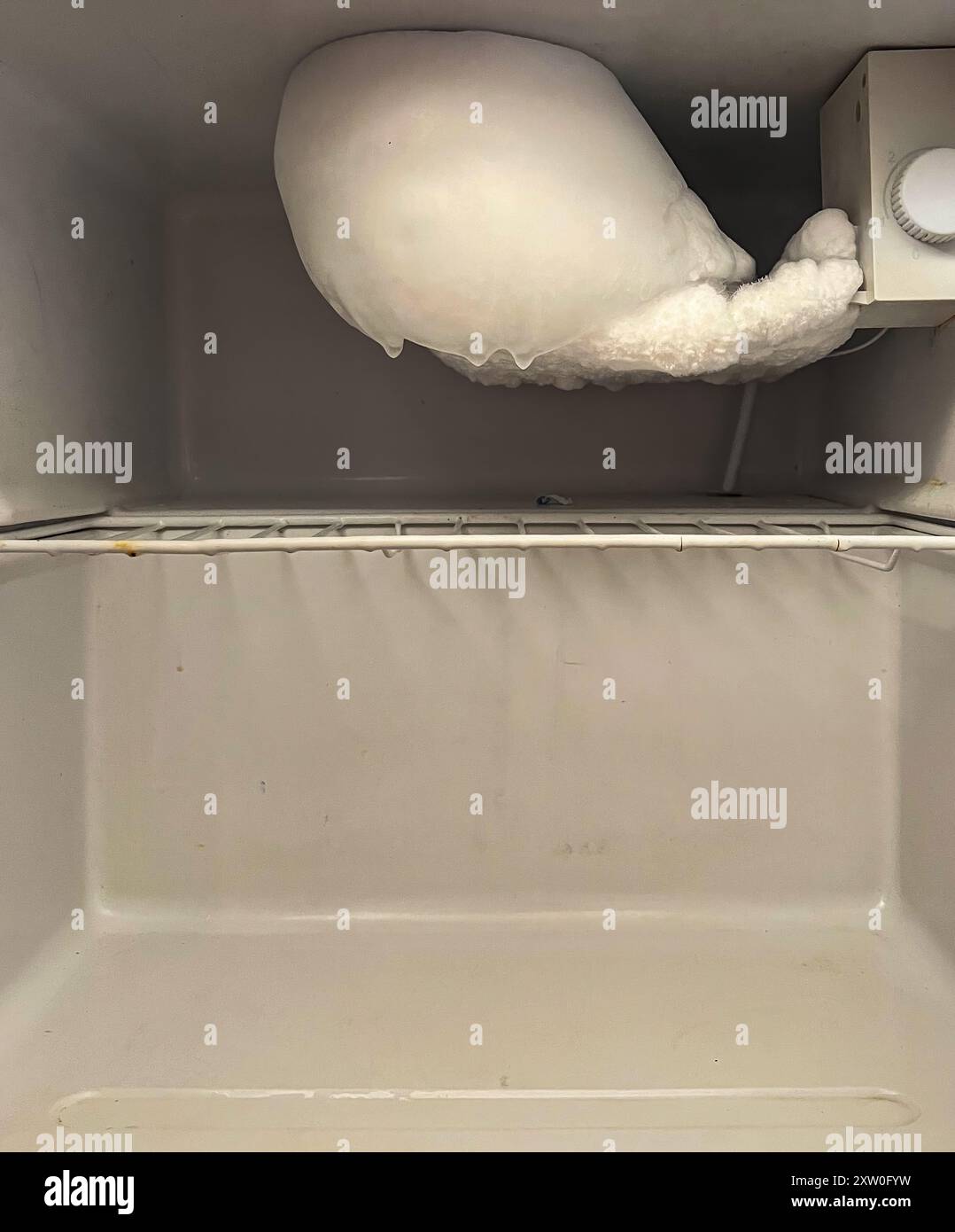 There is a lot of ice inside the freezer. Front view Stock Photo - Alamy