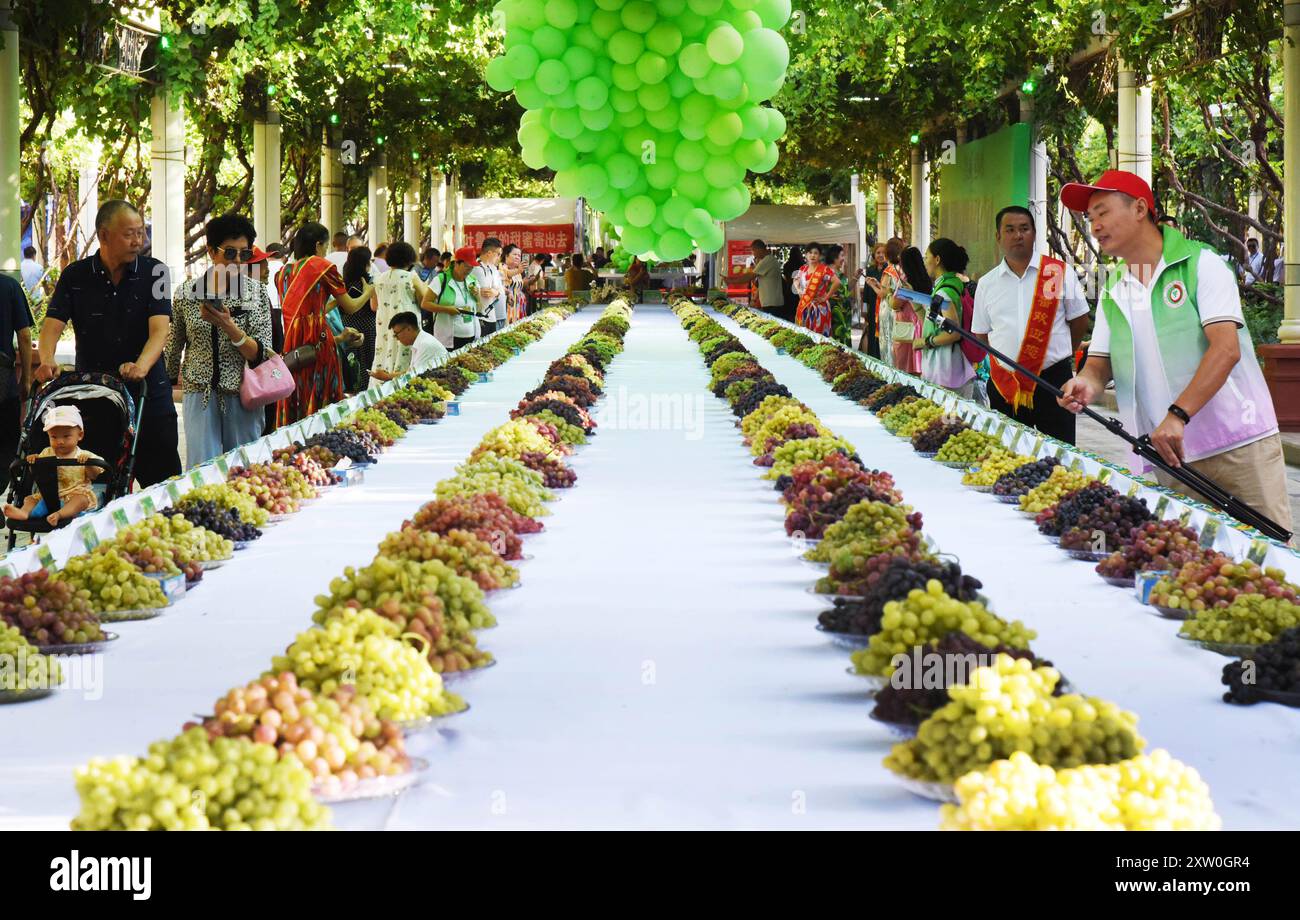 TURPAN, CHINA - AUGUST 16, 2024 - Hundreds of varieties of grapes are ...
