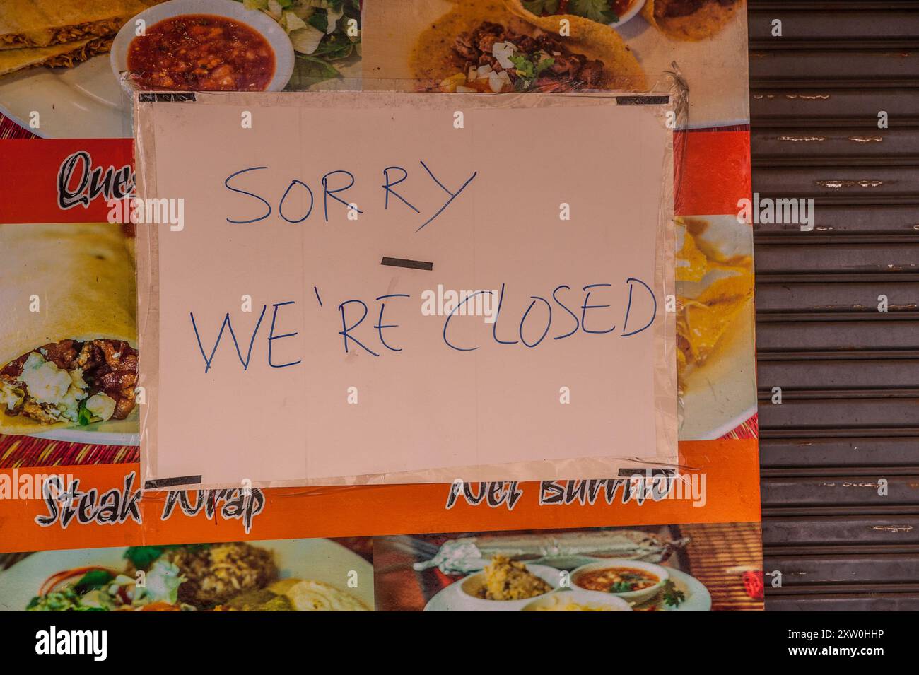 A Mexican restaurant puts up a handwritten "Sorry We're Closed" sign ...