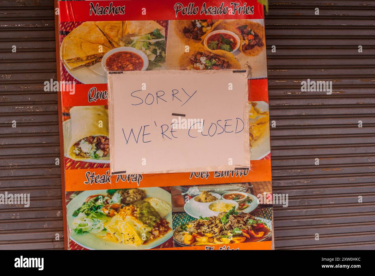 A Mexican restaurant puts up a handwritten "Sorry We're Closed" sign ...