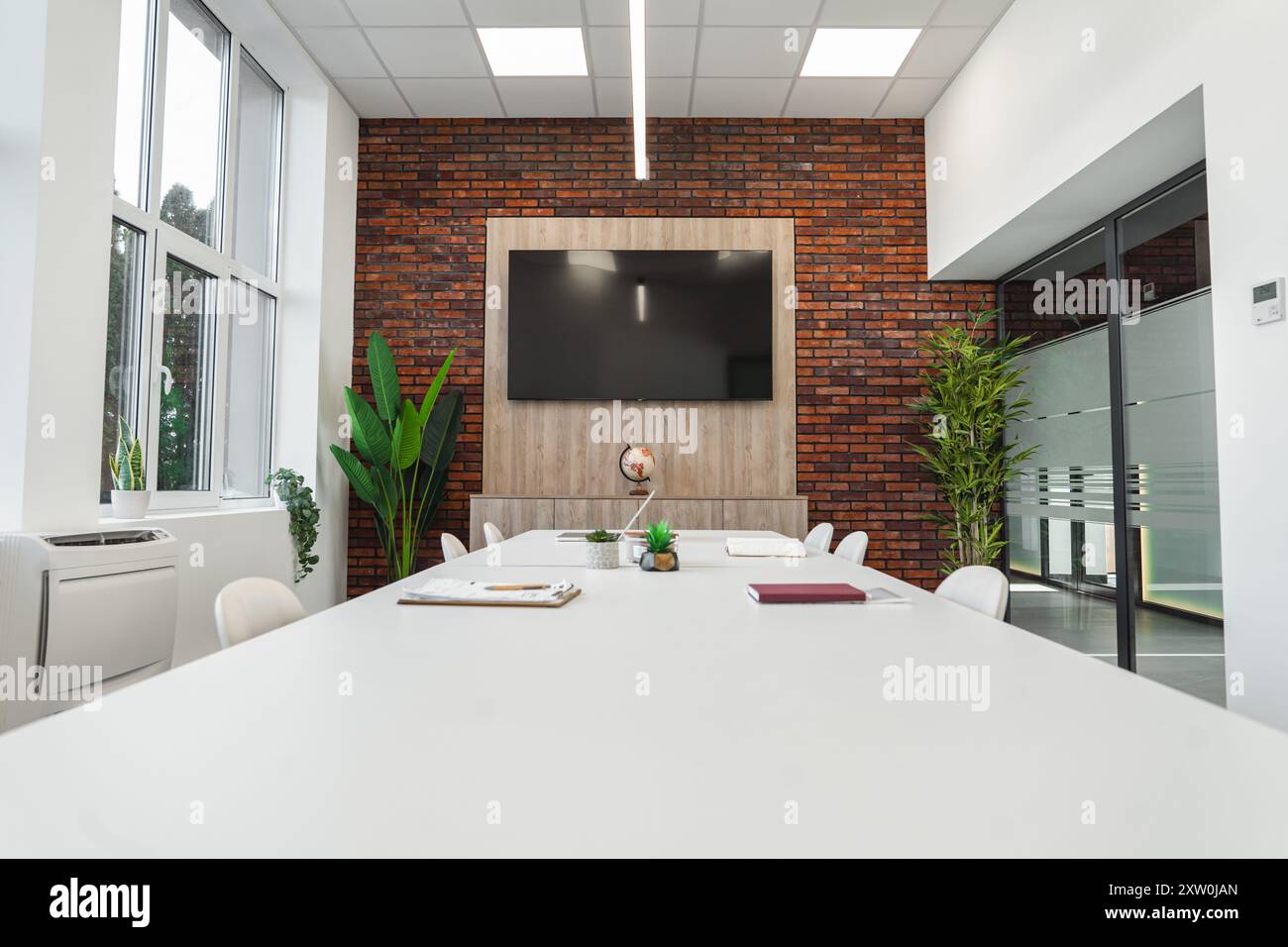 Modern Conference Room With Large Windows and Flat Screen TV Stock ...