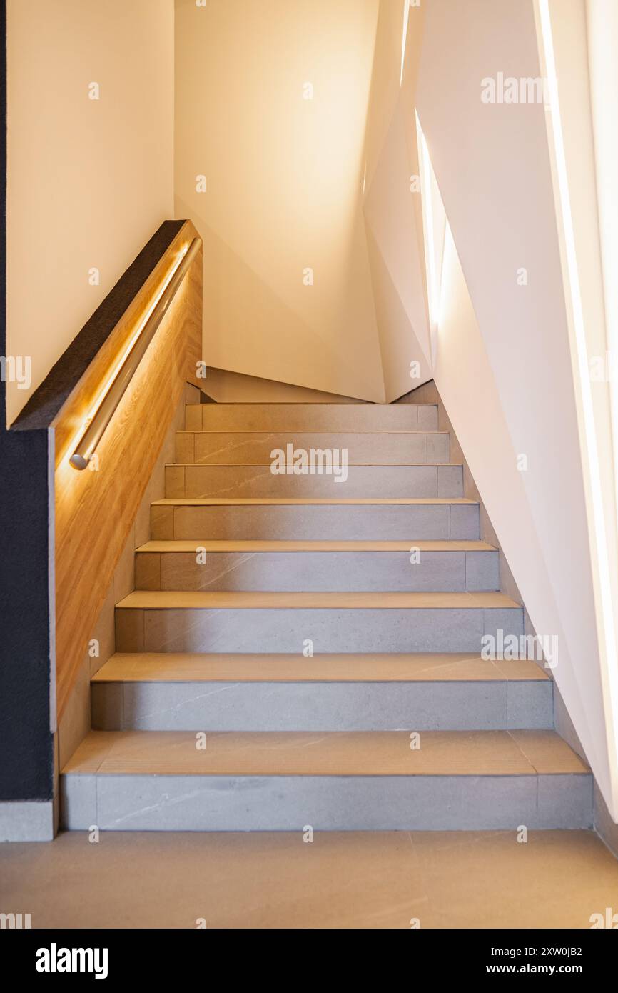 Illuminated stairs in a building Stock Photo - Alamy