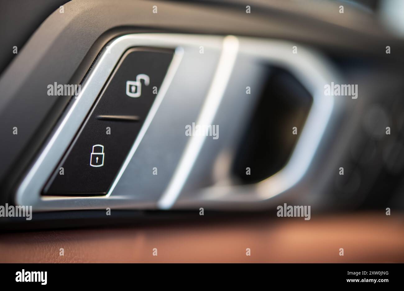 A detailed close-up of an automotive lock button and control panel ...