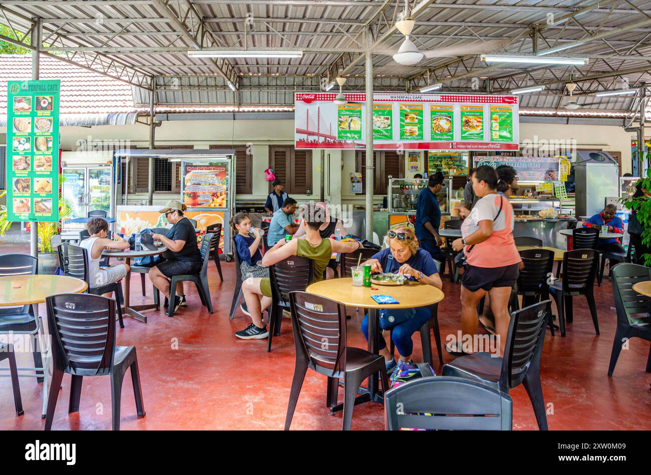 Customers sitting eating food at The Waterfall Cafe on the edge of The ...