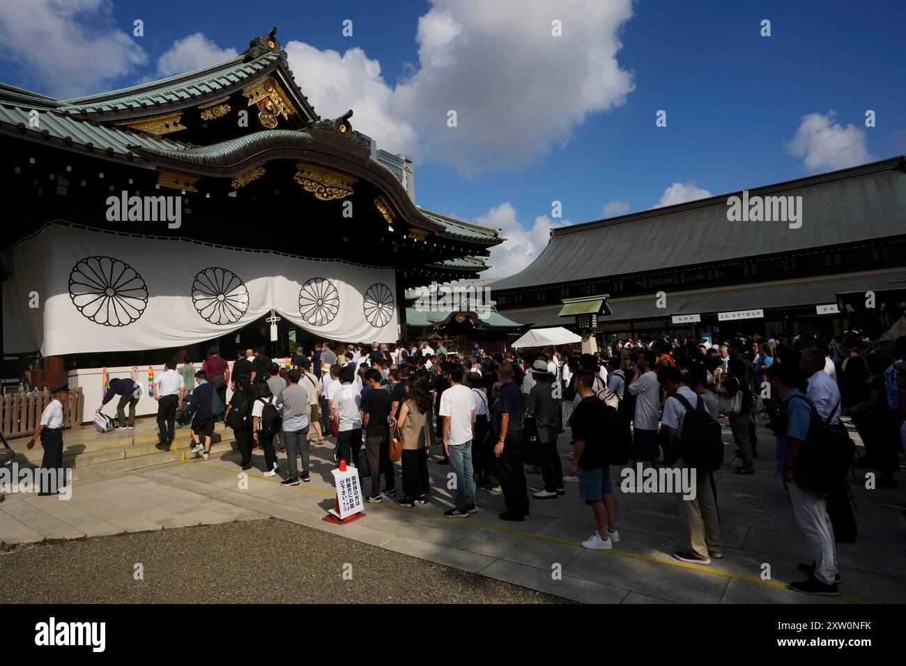People wait in queue before reaching to the front to pray at the main ...