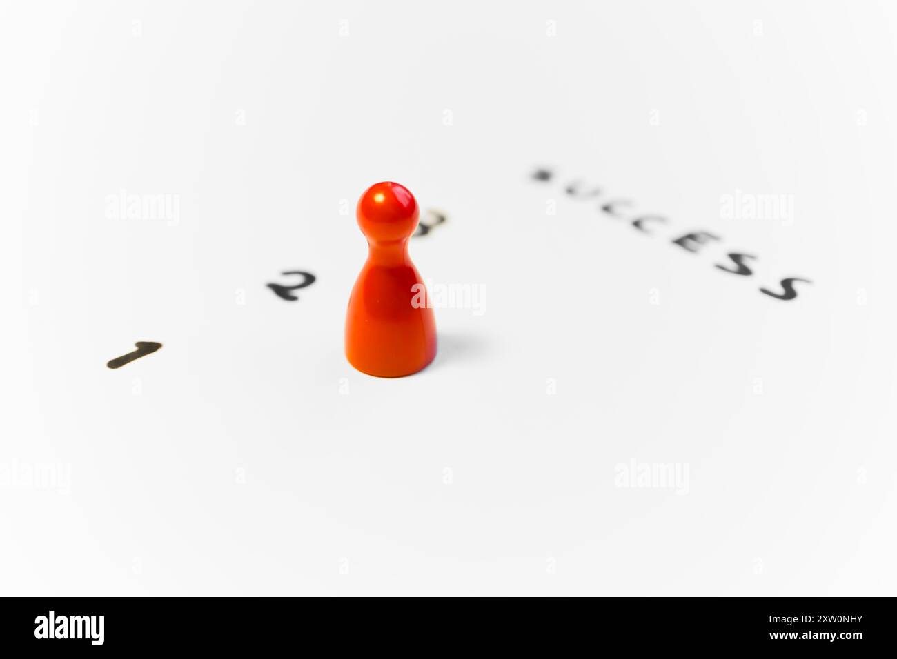 Steps to success with red game piece Stock Photo - Alamy