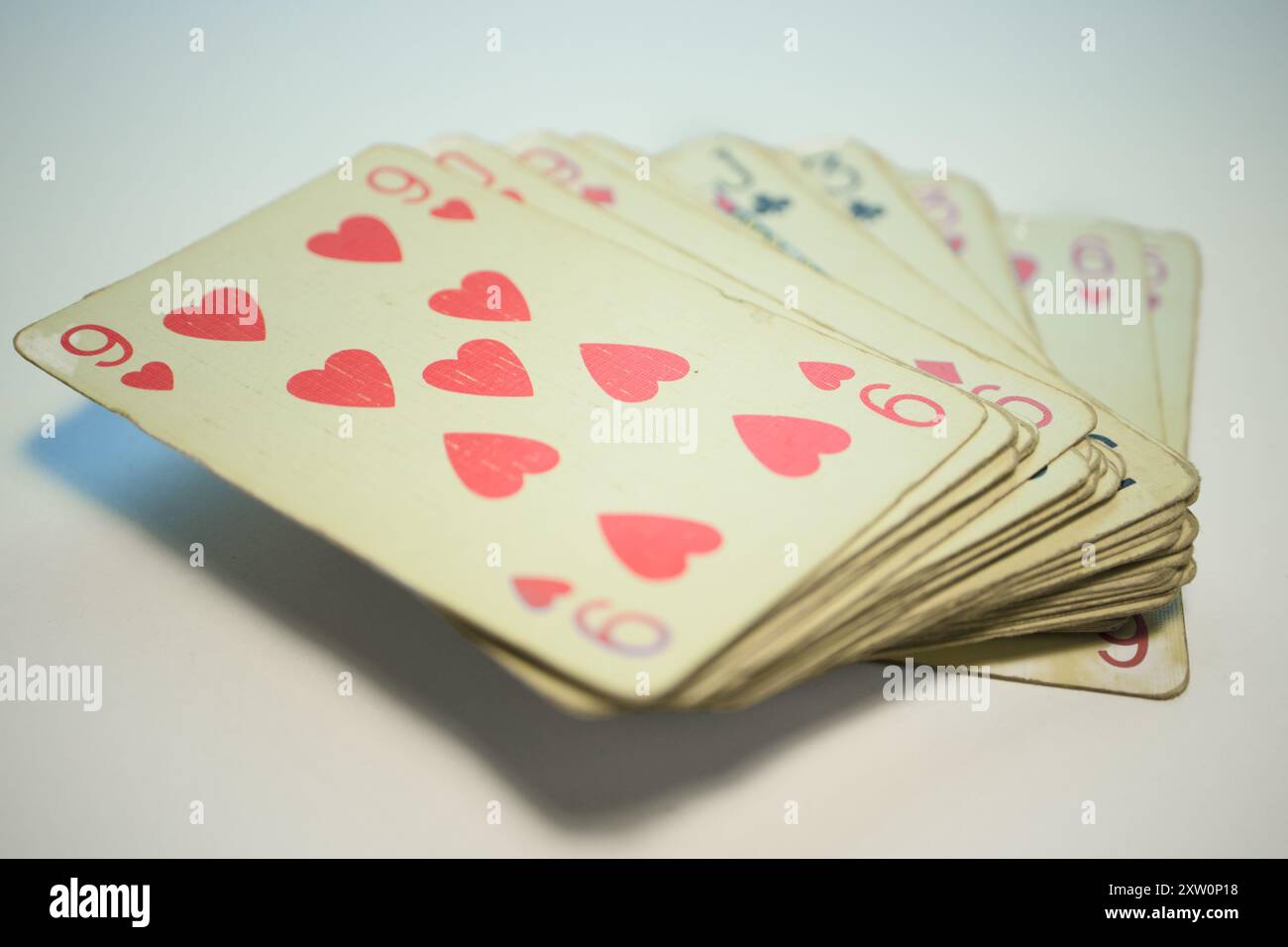 A deck of playing cards fanned out on a white background Stock Photo ...