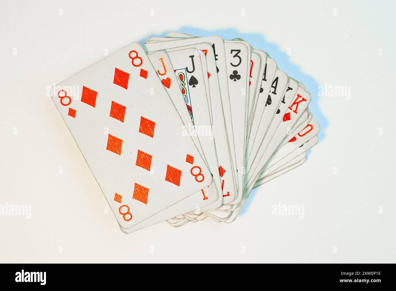 A deck of playing cards fanned out on a white background Stock Photo ...
