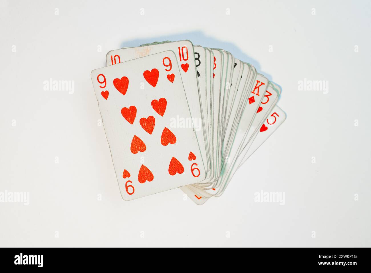 A deck of playing cards fanned out on a white background Stock Photo ...