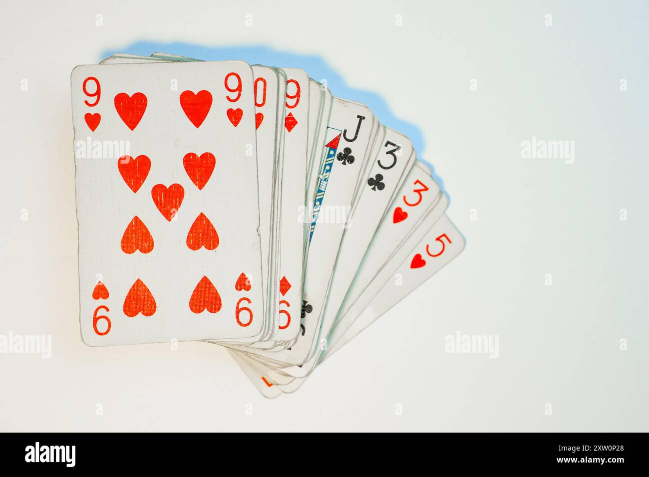 A deck of playing cards fanned out on a white background Stock Photo ...