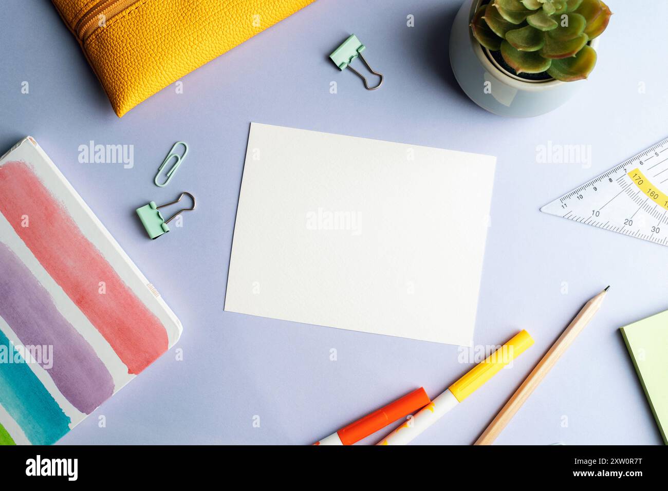 Blank sheet and school supplies, notepad, pencil and felt-tip pens on ...
