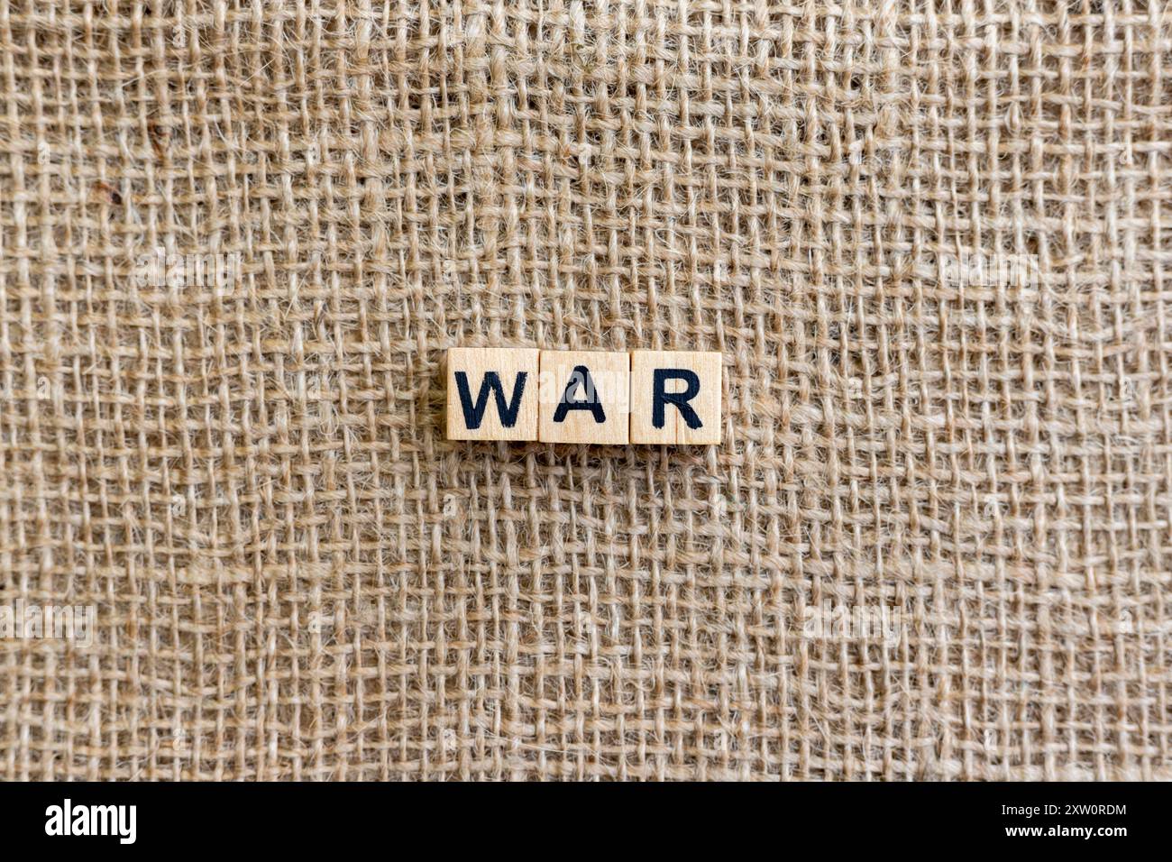 War Message on Wooden Blocks with Burlap Texture Stock Photo - Alamy