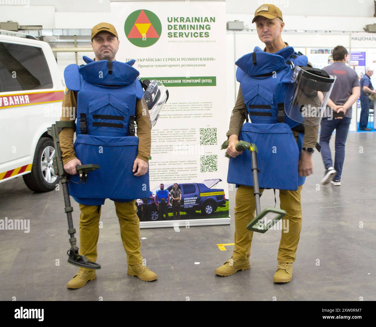 Kyiv, Ukraine, May 28, 2024: Men standing in mine clearance uniform ...