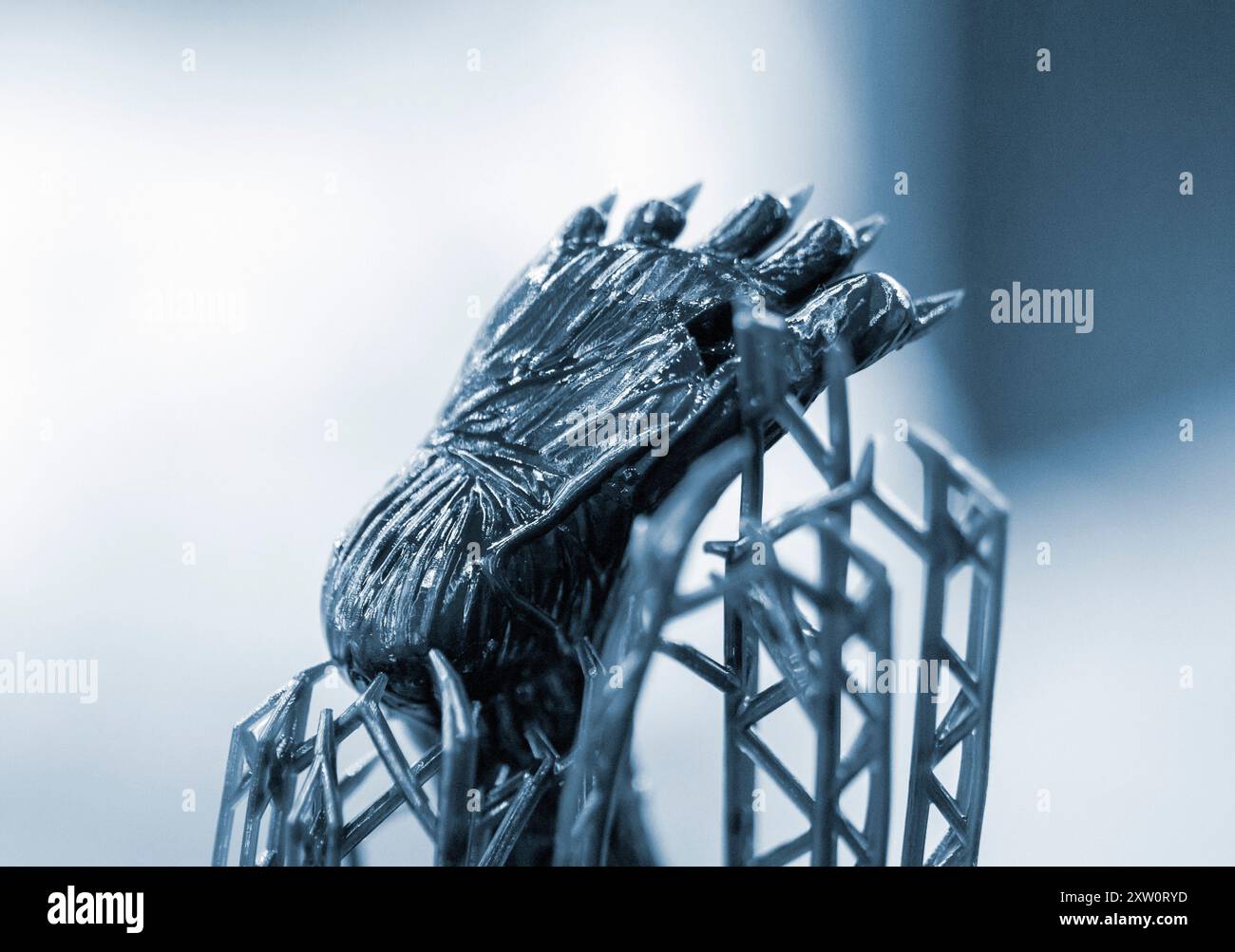 Model of leg printed on a 3D printer from black rubber, close-up. Part ...