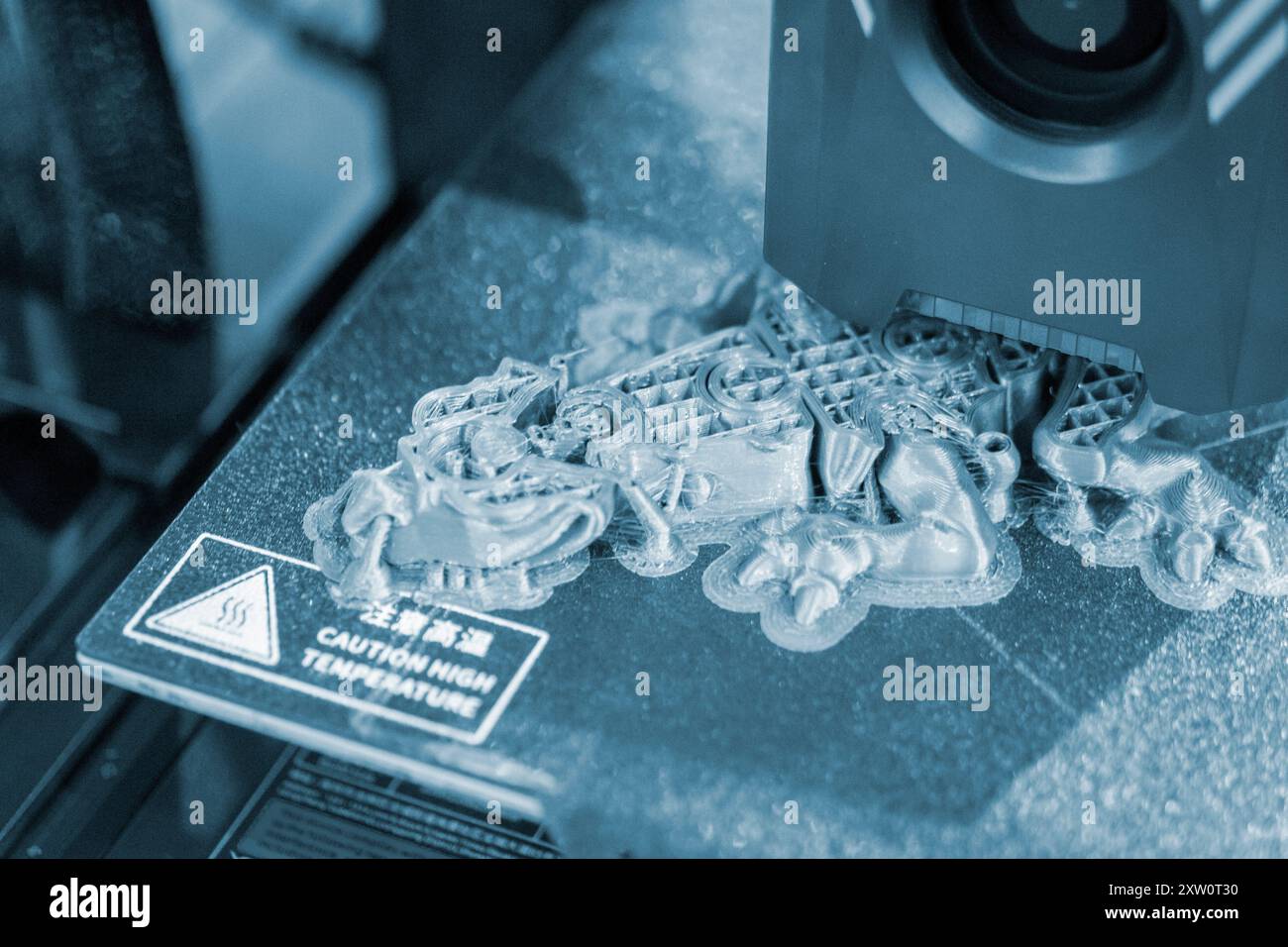 3D printer close up. A working 3D printer in process of printing object ...