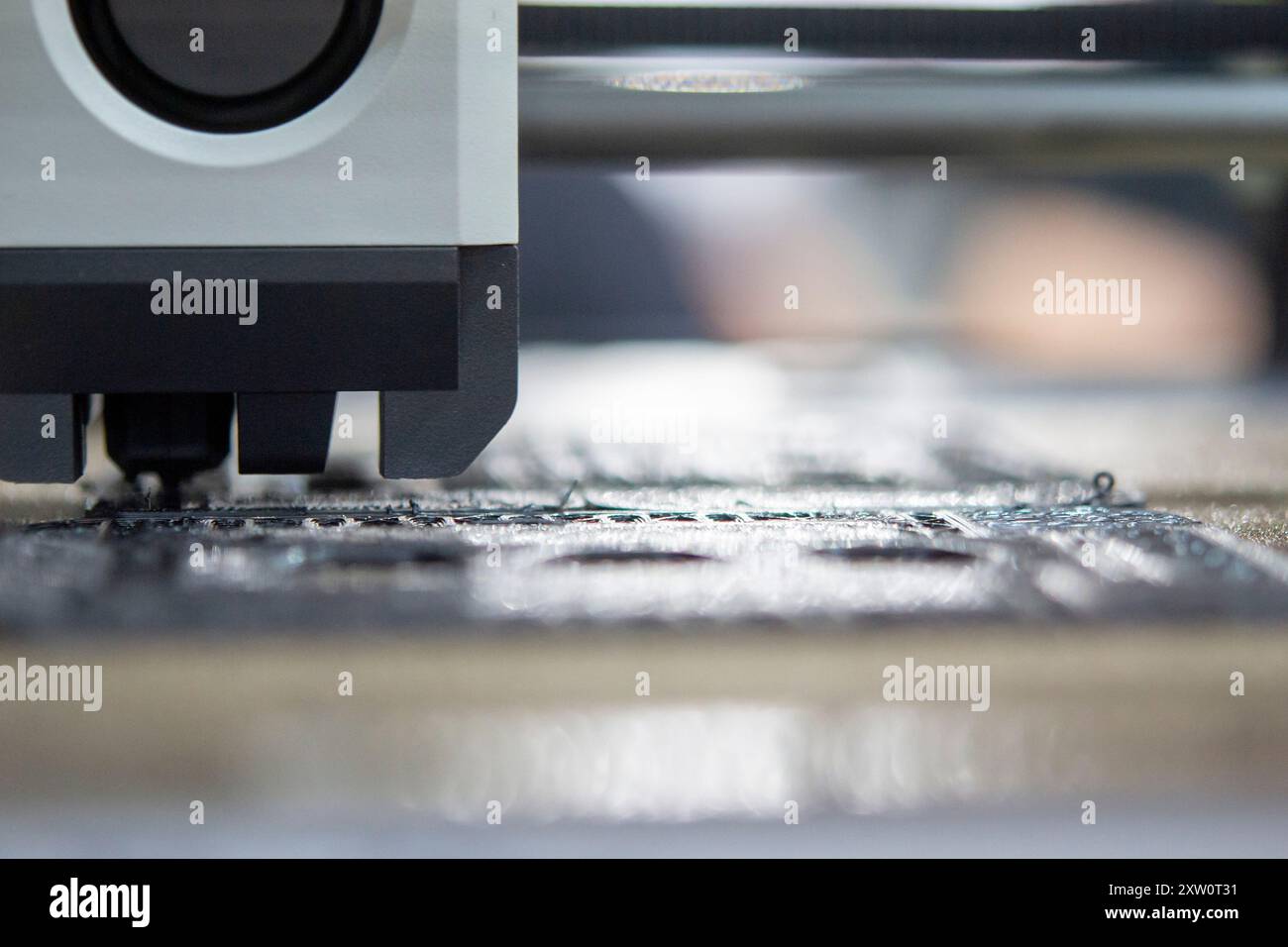 3D printer close up. A working 3D printer in process of printing object ...