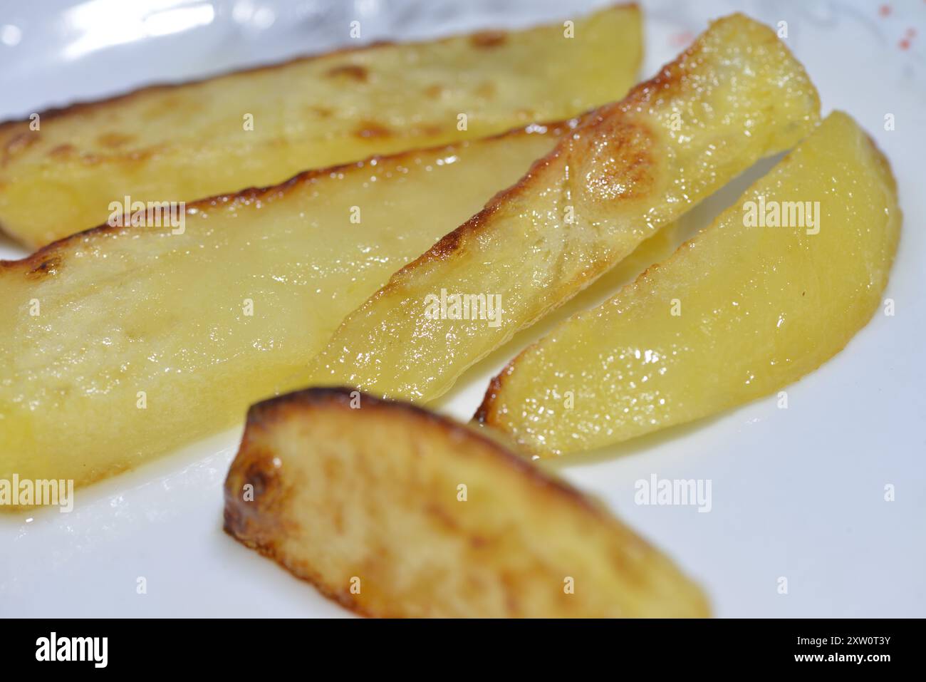 A photo of golden, crispy fried potatoes, capturing the deliciously ...