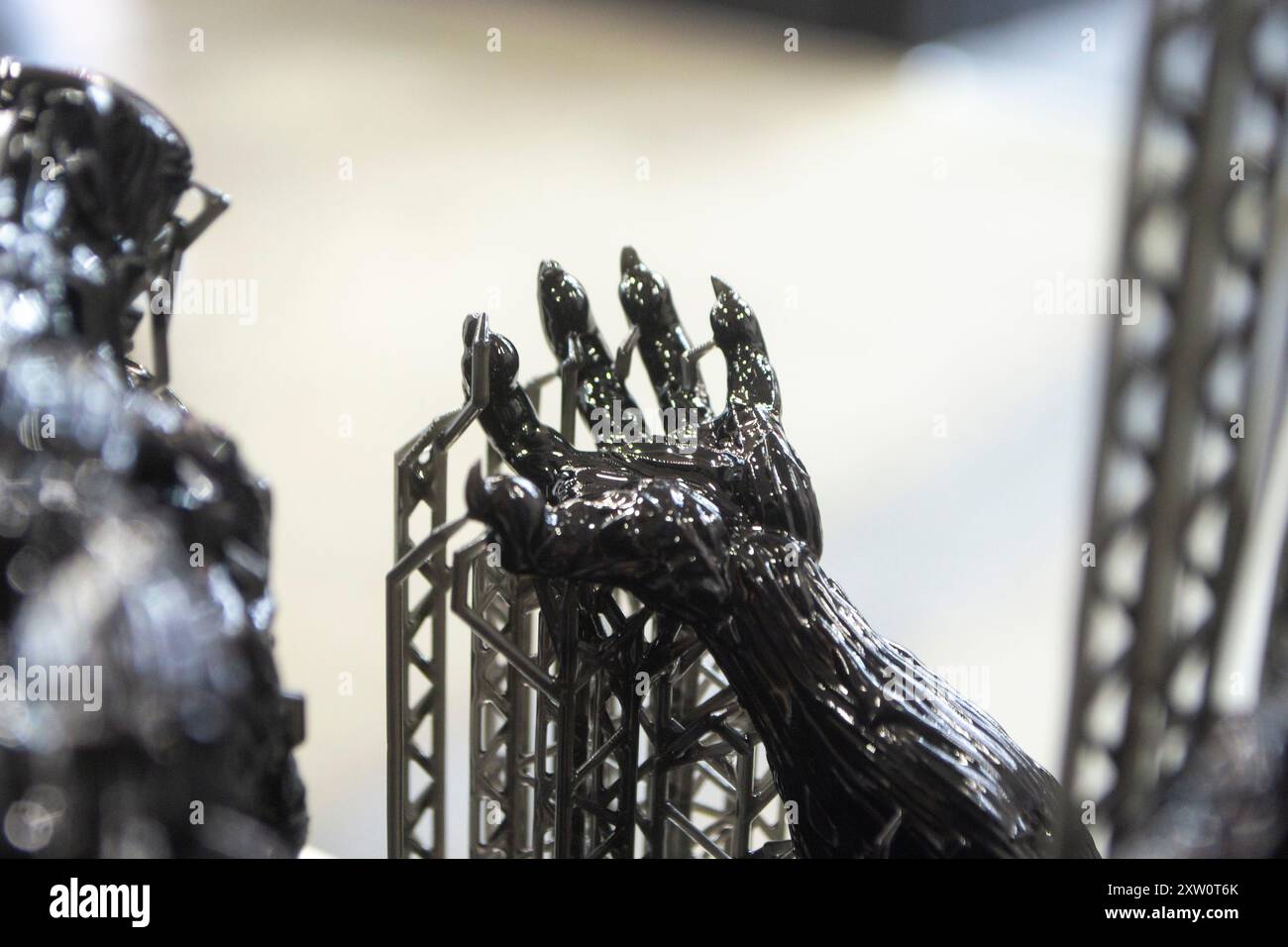 Model of hand printed on a 3D printer from black rubber, close-up. Part ...