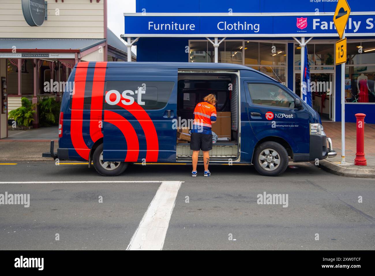 A NZ New Zealand Post driver, complete with New Zealand map tattoo ...