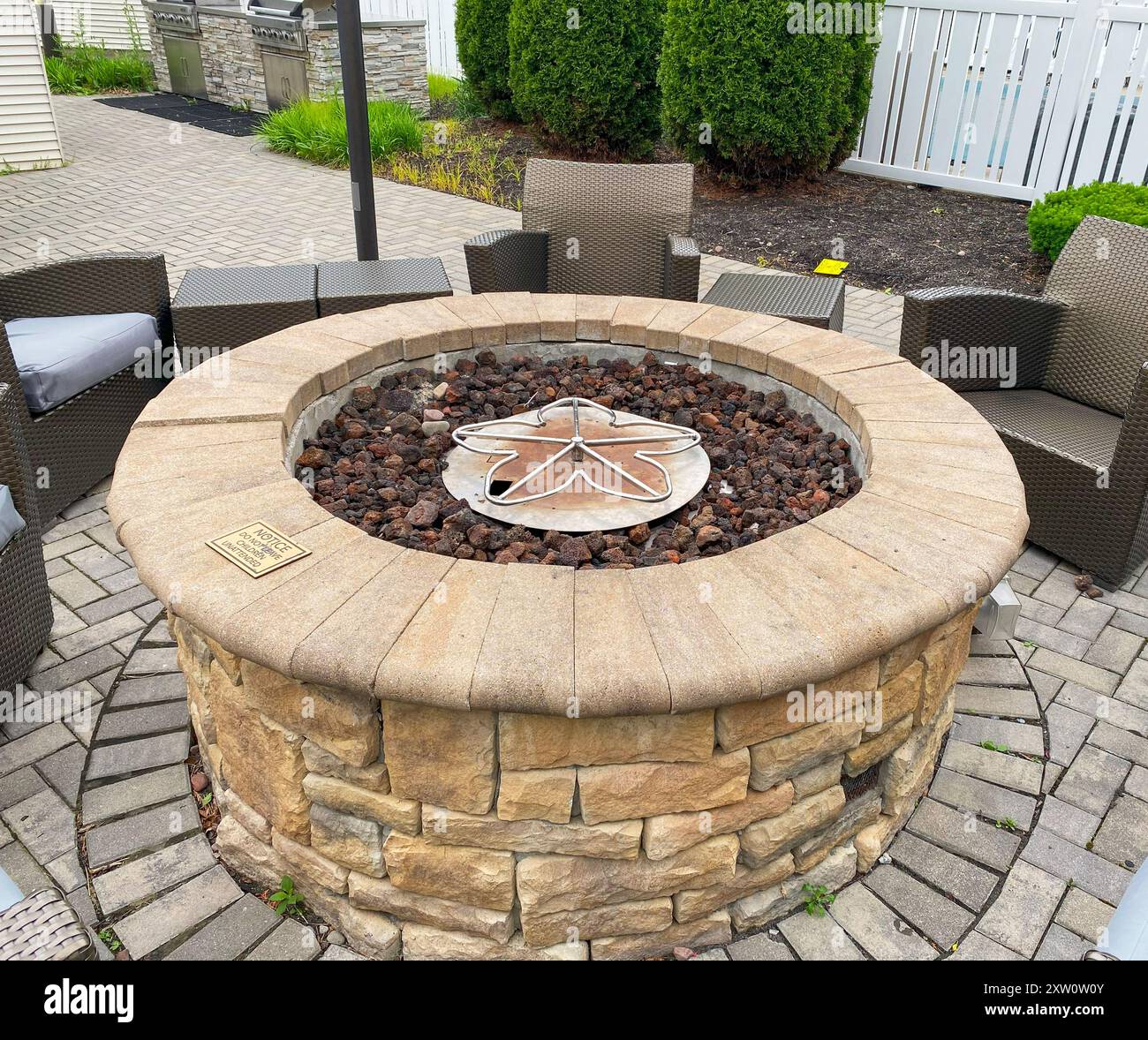 Close up a Hotel Fire Pit surrounded by chairs in a courtyard Stock ...