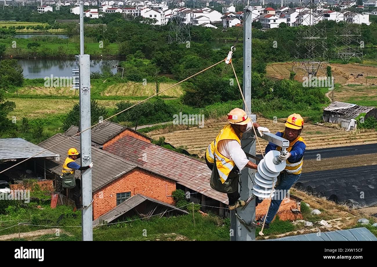 NANCHANG, CHINA - AUGUST 16, 2024 - Construction workers install ...