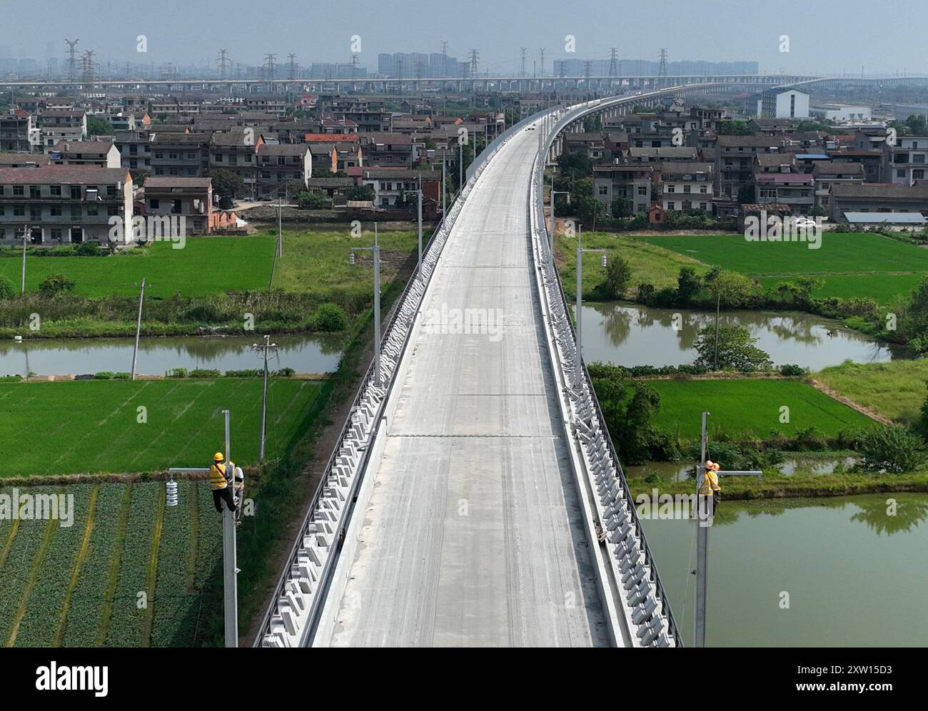 NANCHANG, CHINA - AUGUST 16, 2024 - Construction workers install ...