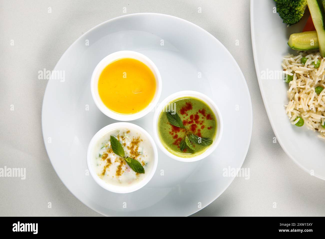 Different tasty sauces in bowls on white table, flat lay. Restaurant ...