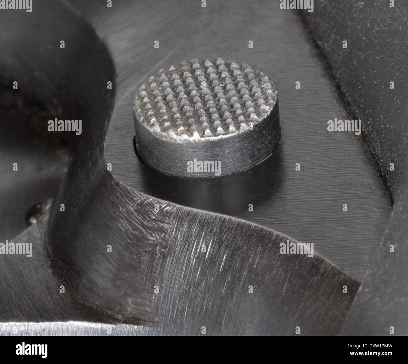 Stock magazine release button on a semi-automatic pistol designed like ...