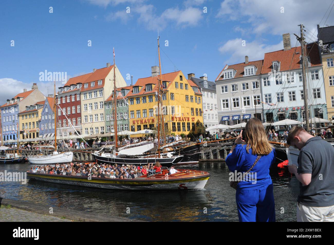 Copenhagen/ Denmark/17 August 2024/TOURISTS LIFE at famous Nyhavn canal ...
