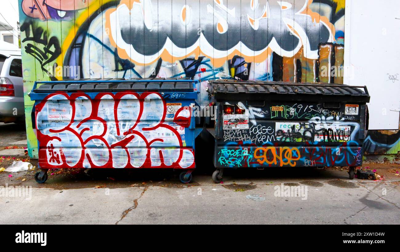 Garbage Containers with Graffiti Stock Photo - Alamy