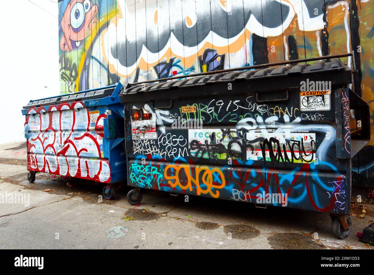 Garbage Containers with Graffiti Stock Photo - Alamy