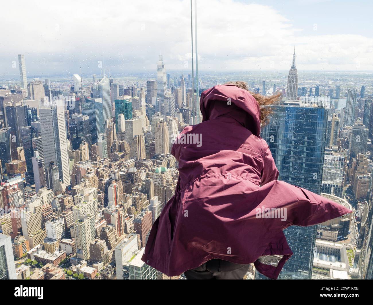 New York, USA - 2 May 2023: The wind is blowing against a tourist ...