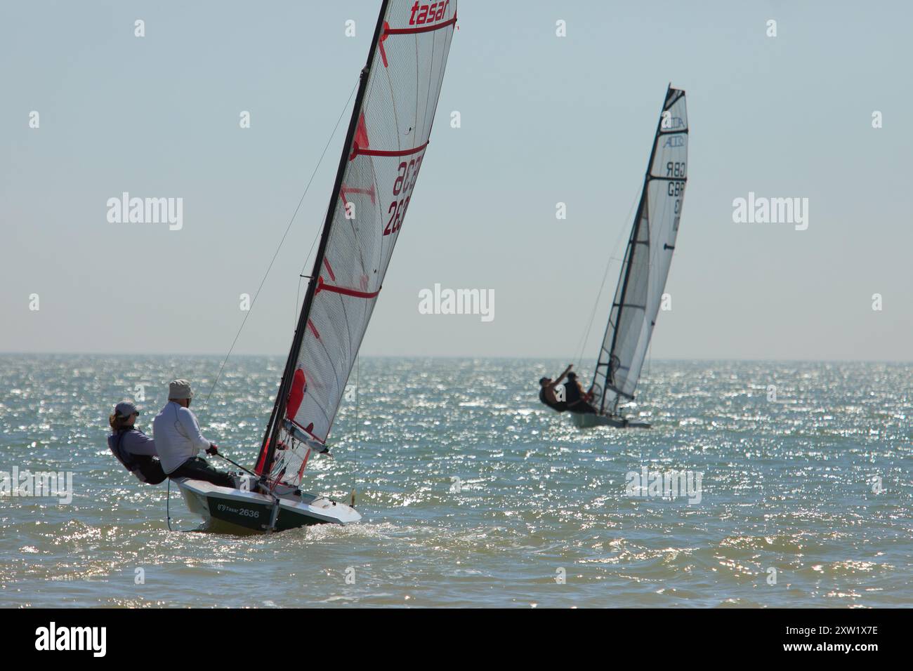 Local sailing enthusiatsts enjoying dinghy racing at Hythe,Kent,UK ...