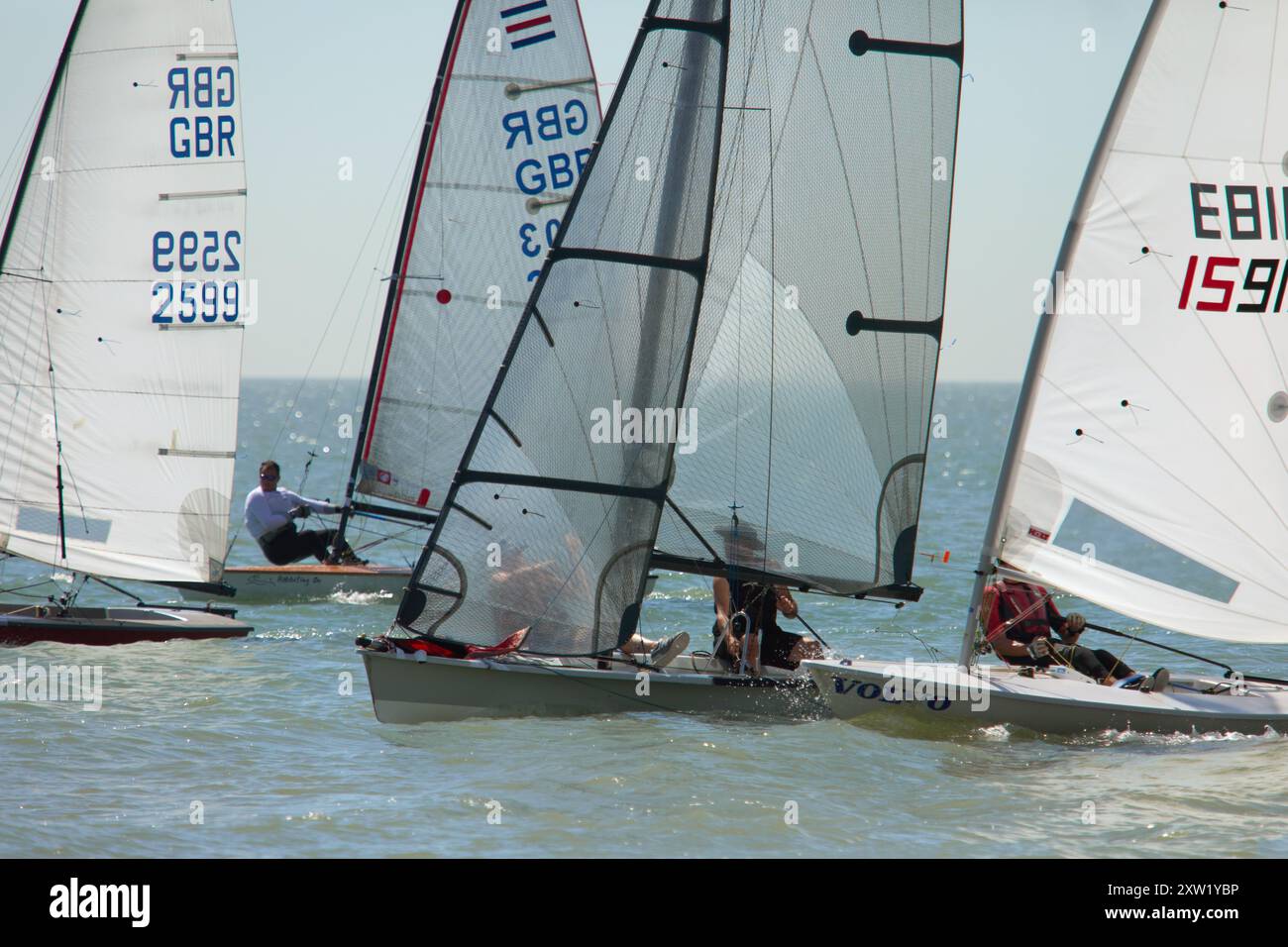 Local sailing enthusiatsts enjoying dinghy racing at Hythe,Kent,UK ...