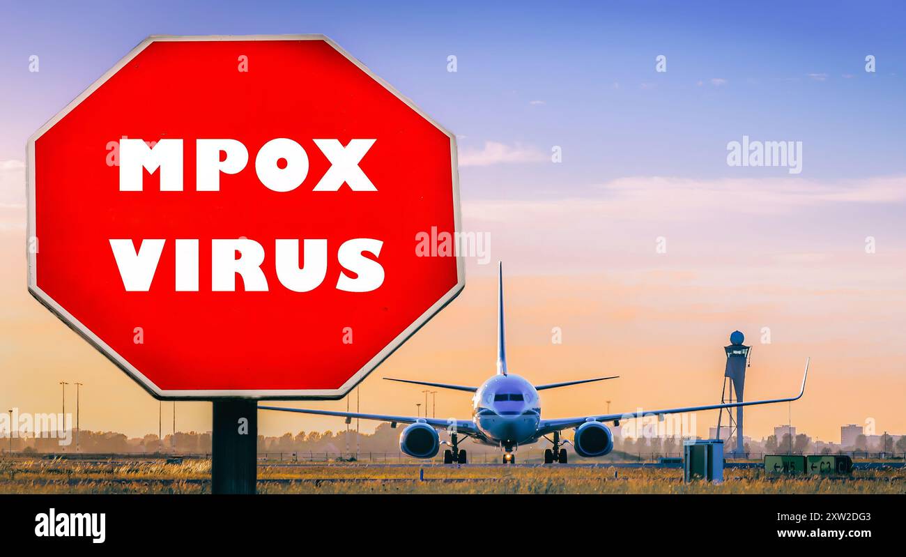 A red stop sign displaying the words mpox virus stands prominently near ...