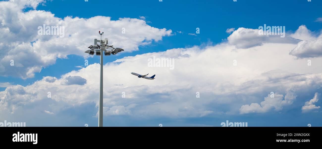 An airliner taking off and about to reach altitude above clouds in deep ...