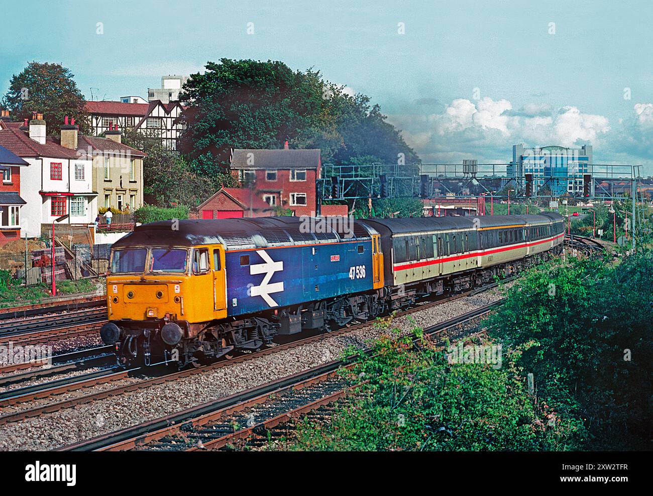 A Class 47 diesel locomotive number 47536 in large logo livery heads ...
