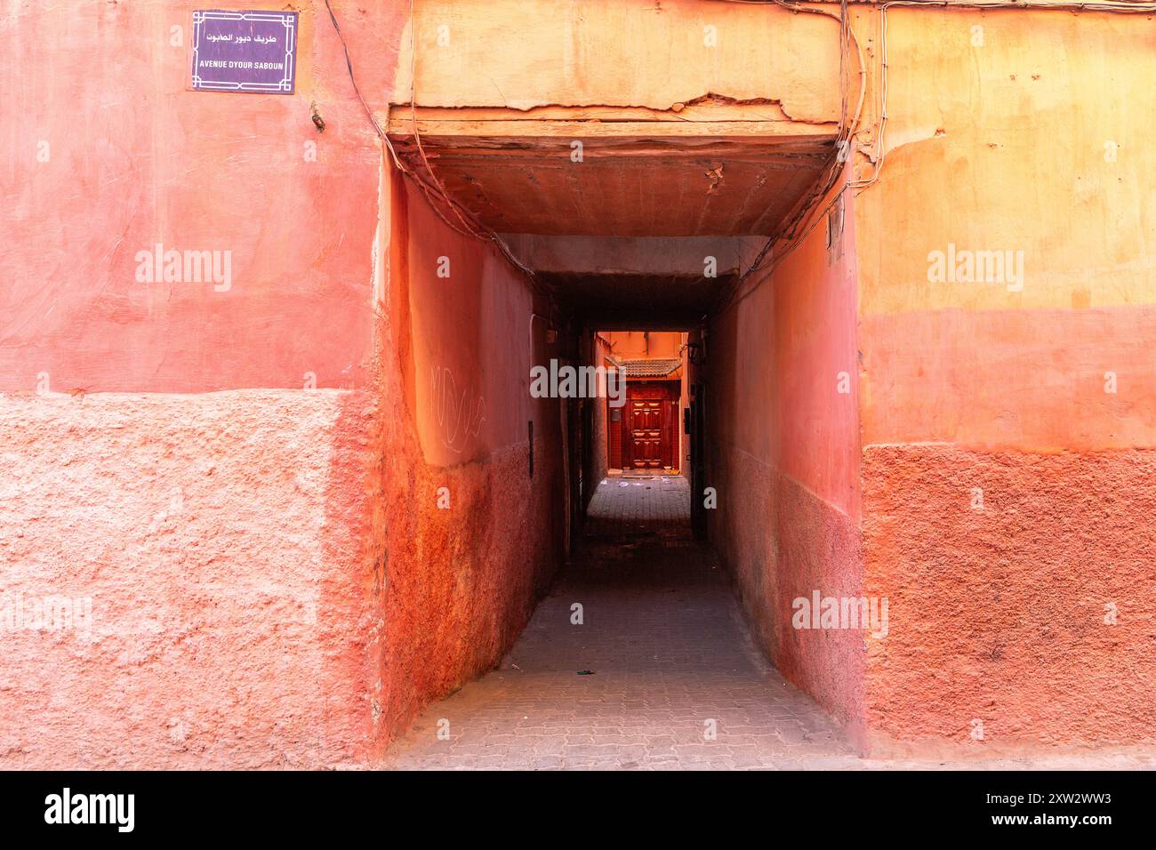 A long dark passage leads to a closed door opposite a small inner ...