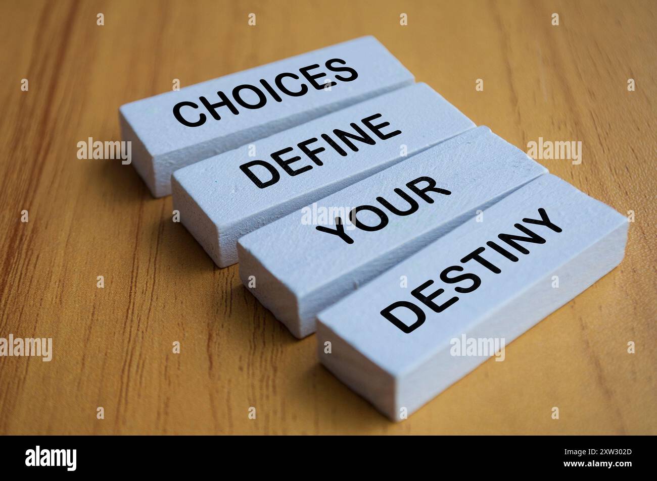 Angel view of Choice define your destiny text on white wooden blocks ...
