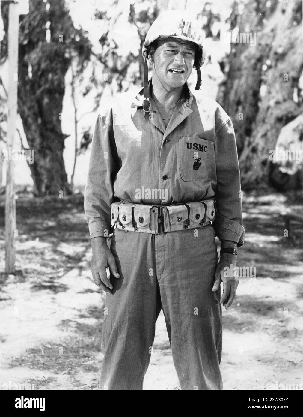 A portrait of JOHN WAYNE as Sergeant Stryker in SANDS OF IWO JIMA 1949 ...