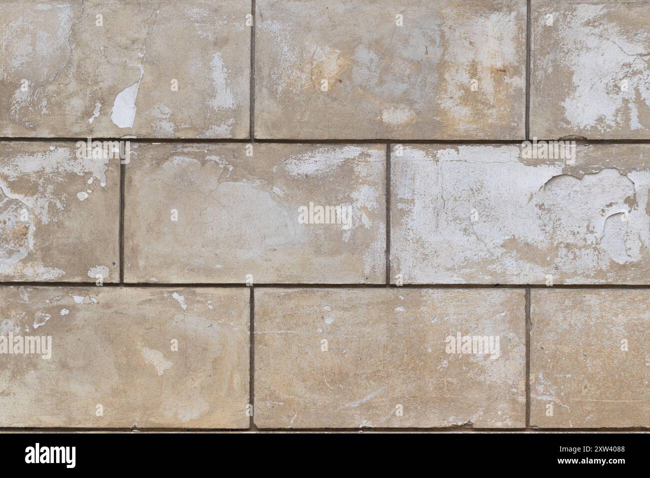 Stone blocks covered with cracked plaster. Backgrounds and textures ...