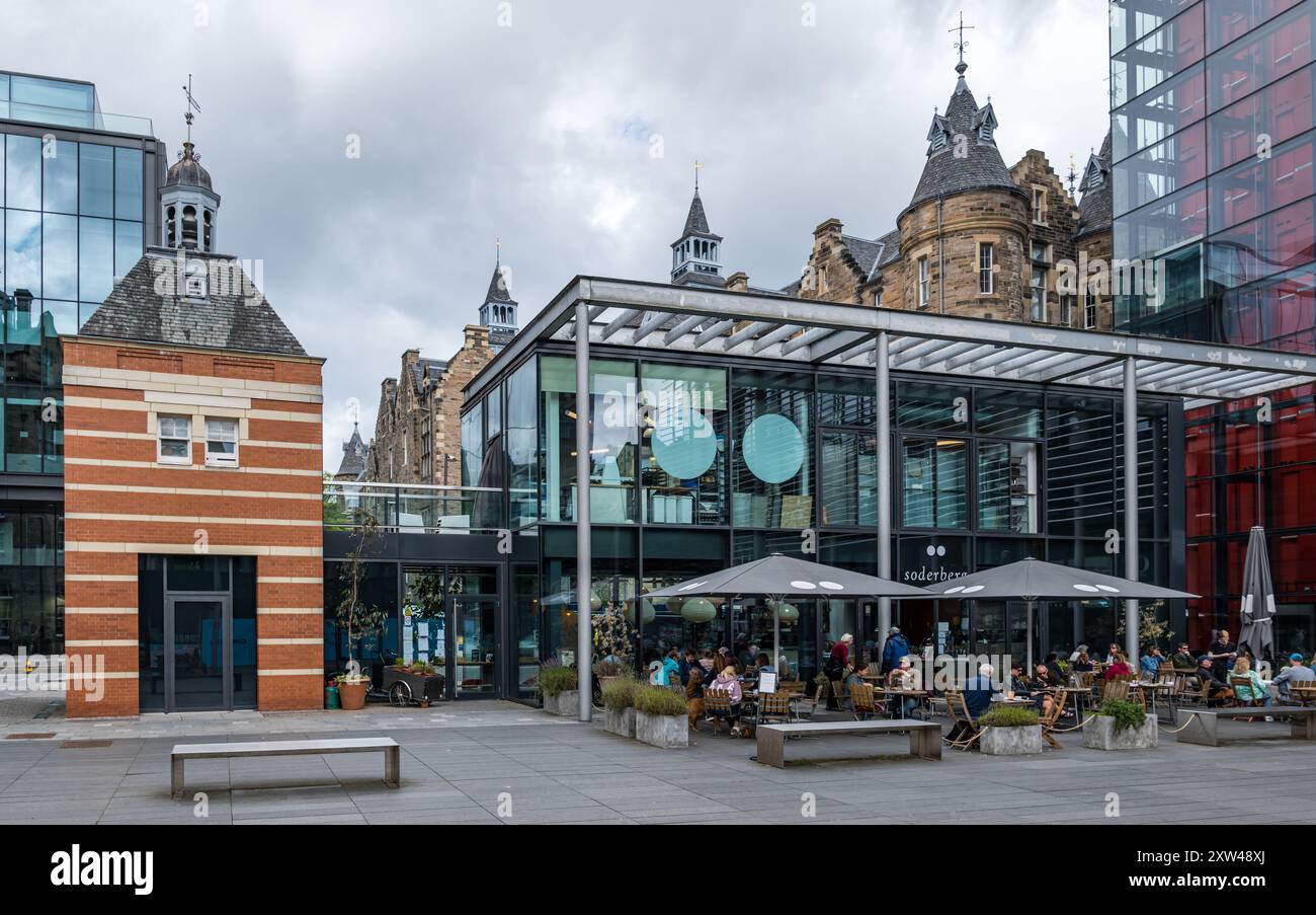 Old and modern buildings in Quartermile with people sitting in ...