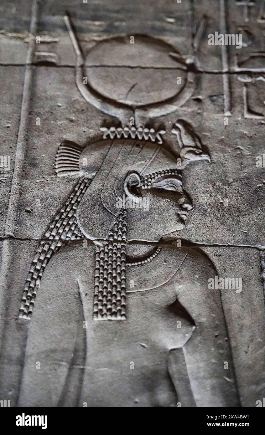 Isis, Mother Goddess, Close up wall relief in soft bokeh focus in the ...