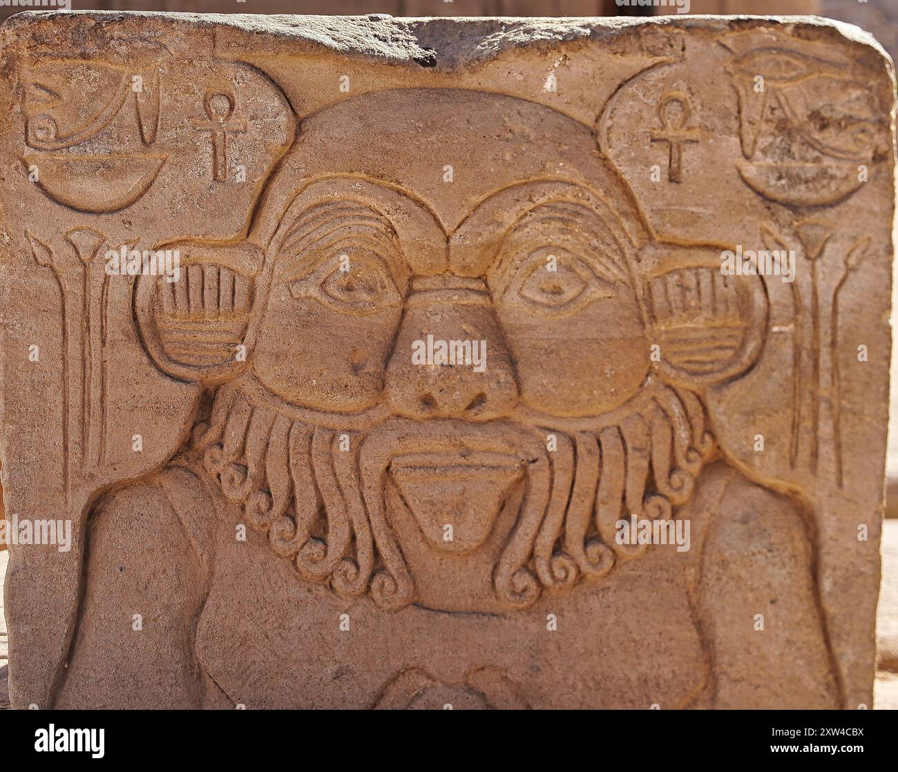 Detailed stone carving of the Egyptian God Bes,protector of households ...