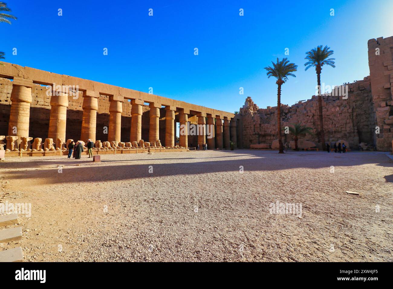 The outer courtyard of the Kom Ombo temple with a line of ram headed ...